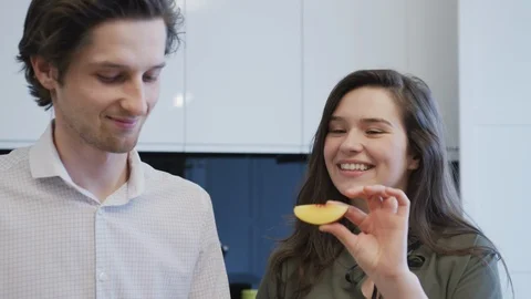 Couple eating an apple and kissing | Stock Video | Pond5