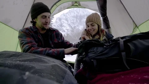 Couple Grab Gear From Their Pack, Man Ha... | Stock Video | Pond5