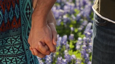 Couple Holds Hands In Slow Motion in Fie... | Stock Video | Pond5