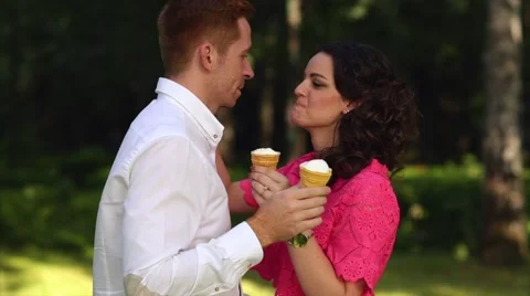 Couple in Love Eating Ice Cream and Kiss... | Stock Video | Pond5