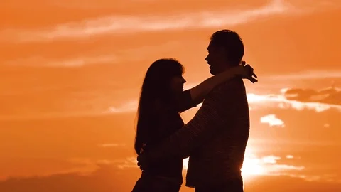 couple in love hugging at sunset sunligh... | Stock Video | Pond5