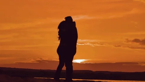 couple in love hugging at sunset sunligh... | Stock Video | Pond5