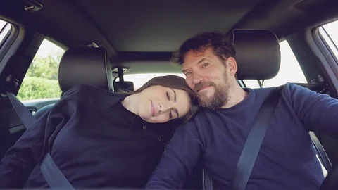 Couple in love kissing in car while driv... | Stock Video | Pond5