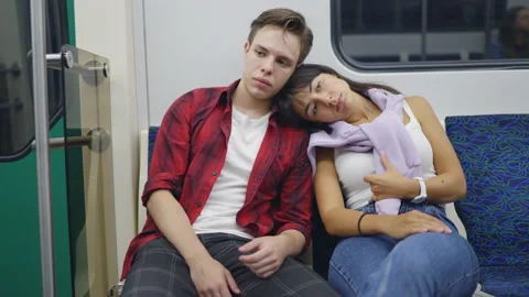 A couple rides in the subway, sit, fall ... | Stock Video | Pond5