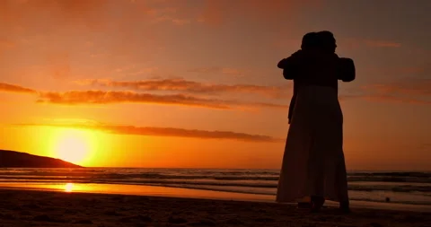 Couple, silhouette and hug at beach, sun... | Stock Video | Pond5