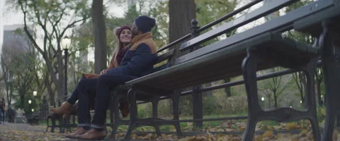 Couple Sit Talking On Park Bench | Stock Video | Pond5