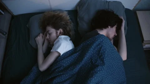 Couple sleeping in bed, woman running he... | Stock Video | Pond5