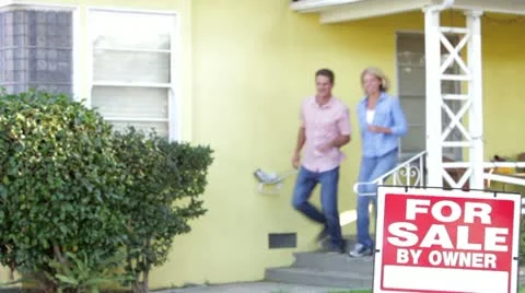 Couple Standing By For Sale Sign Outside... | Stock Video | Pond5