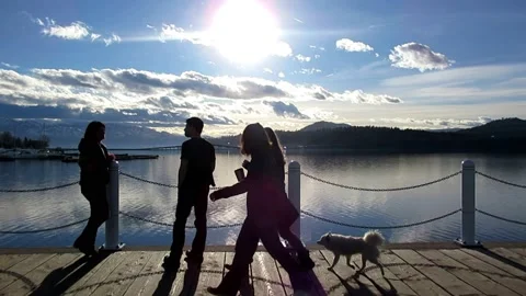 couple talking by the lake, people walki... | Stock Video | Pond5