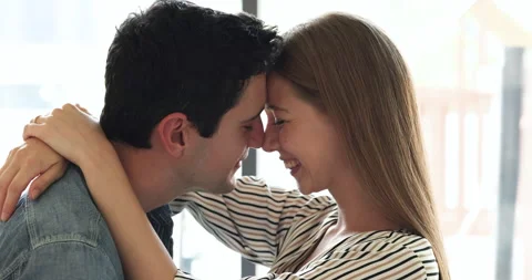 Couple touch their foreheads, smiling, c... | Stock Video | Pond5