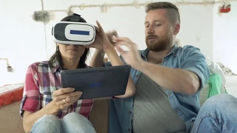 Couple with vr goggle and tablet watchin... | Stock Video | Pond5