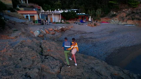 Couple walking on apath villas shore Elb... | Stock Video | Pond5
