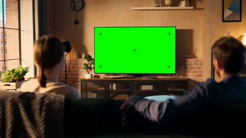 Couple Watching TV with Green Screen in ... | Stock Video | Pond5