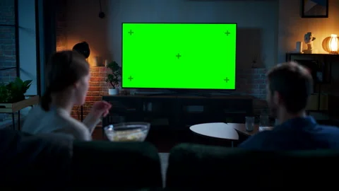 Couple Watching TV with Green Screen in ... | Stock Video | Pond5