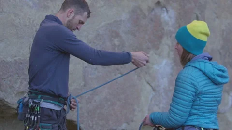 Couple Wearing Harnesses and Gear Prepar... | Stock Video | Pond5