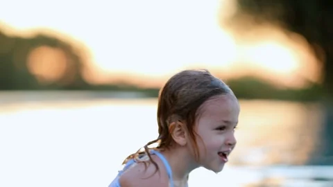Courageous small girl diving into swimmi... | Stock Video | Pond5