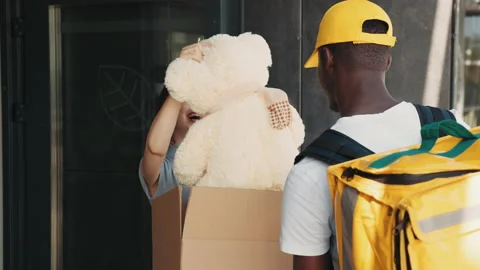 Courier bring a parcel to a little girl ... | Stock Video | Pond5