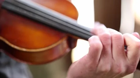 A cowboy playing the fiddle for square d... | Stock Video | Pond5