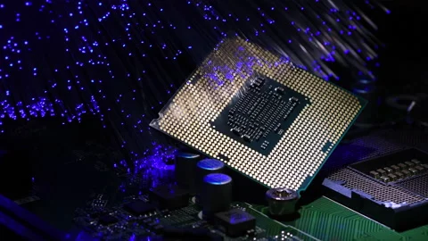 CPU on a PC motherboard illuminated by a... | Stock Video | Pond5