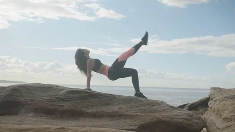 Crab kicks ab workout. Girl trains her a... | Stock Video | Pond5