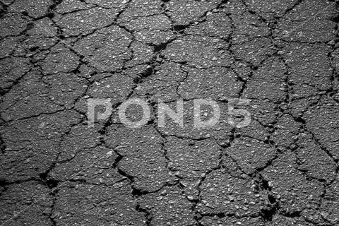Photograph: Cracked asphalt texture. Top view. Asphalt. Road background ...