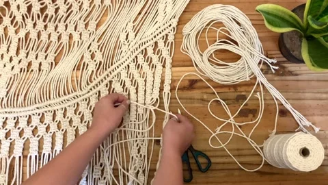 Crafting a Macrame wall hanger by hand | Stock Video | Pond5