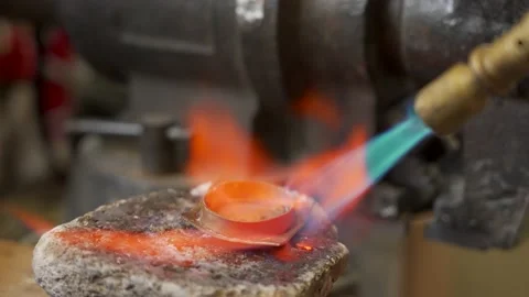 Craftsman soldering the tip of the scabb... | Stock Video | Pond5