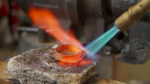 Craftsman soldering the tip of the scabb... | Stock Video | Pond5