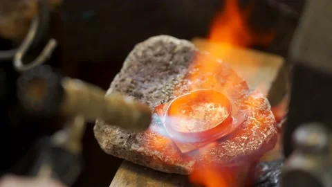 Craftsman soldering the tip of the scabb... | Stock Video | Pond5