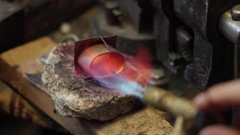 Craftsman soldering the tip of the scabb... | Stock Video | Pond5