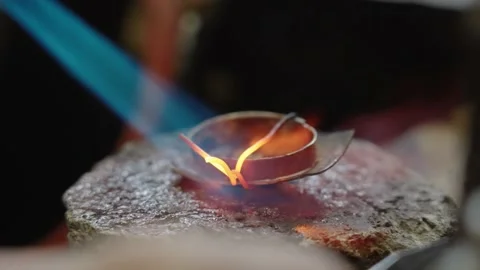 Craftsman soldering the tip of the scabb... | Stock Video | Pond5