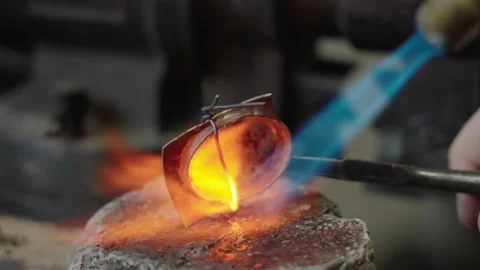 Craftsman soldering the tip of the scabb... | Stock Video | Pond5