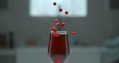 Cranberries falling in a glass of cranbe... | Stock Video | Pond5