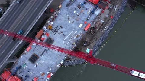 Crane by busy highway bridge constructio... | Stock Video | Pond5