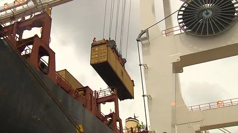 Crane lifting cargo box onto truck at Po... | Stock Video | Pond5