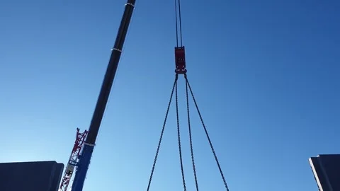 Crane lifting heavy wall panel for house... | Stock Video | Pond5