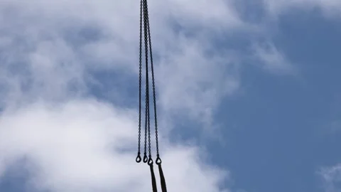 Crane load chains swing in the wind | Stock Video | Pond5