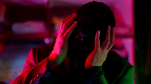crazy man with black mask on head in dar... | Stock Video | Pond5