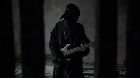 Crazy plague doctor with an electric gui... | Stock Video | Pond5