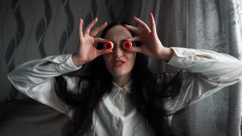 Crazy woman with scary red eyes grimacin... | Stock Video | Pond5