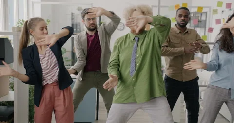 Crazy young employees dancing in office ... | Stock Video | Pond5