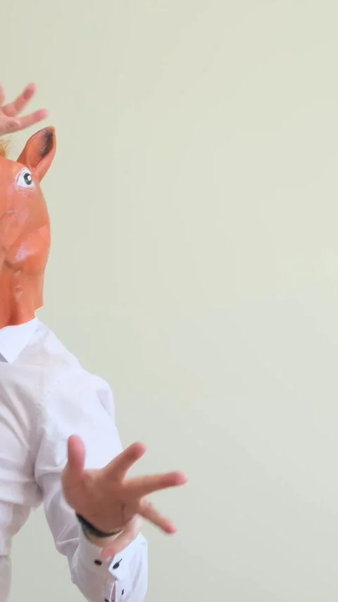 Crazy young man in a horse mask dancing ... | Stock Video | Pond5