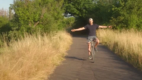 Crazy young man riding a bicycle with no... | Stock Video | Pond5
