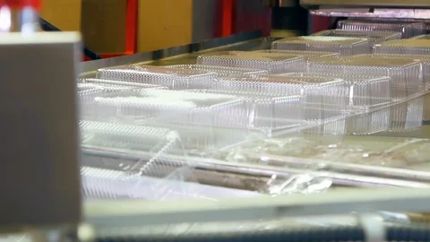 Create plastic package and pack. Goods m... | Stock Video | Pond5