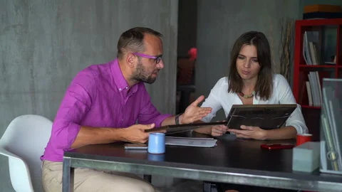 Creative couple arguing over poster desi... | Stock Video | Pond5