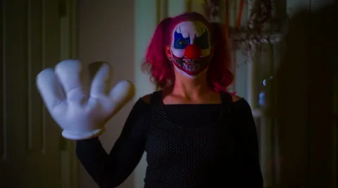 creepy clown wave waving inside | Stock Video | Pond5