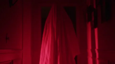 Creepy Figure In Red Room | Stock Video | Pond5