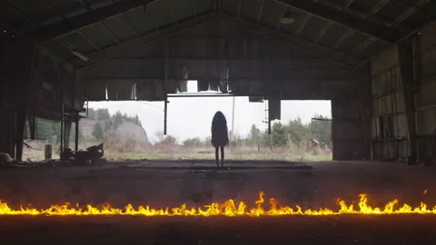 Creepy Figure Standing Behind a Line of ... | Stock Video | Pond5