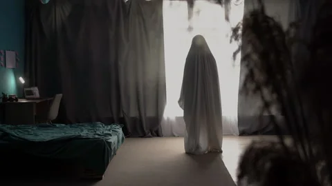 Creepy ghost figure in mysterious window... | Stock Video | Pond5