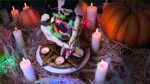 Creepy skeletal hands show pile of candy... | Stock Video | Pond5